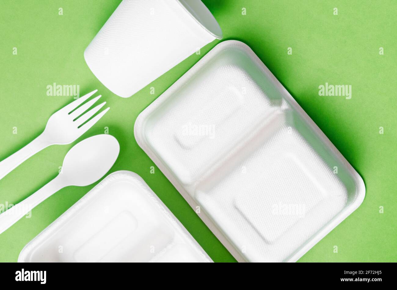 Eco friendly biodegradable paper disposable for packaging food on green ...