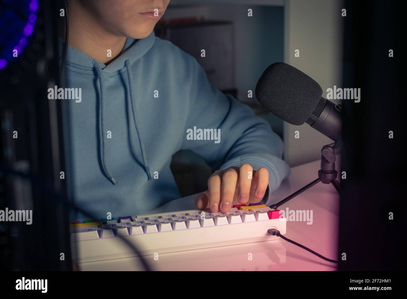 Video game streamers playing on their home console. Teenager playing ...