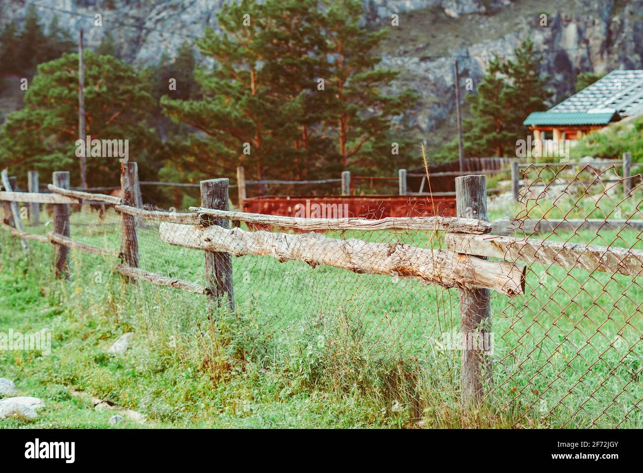 old fence grid on a dacha plot far from the city Stock Photo - Alamy