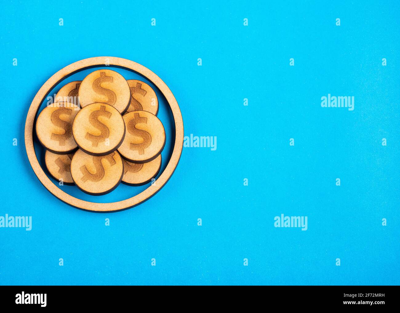 Savings concept with coins - Blue background Stock Photo - Alamy