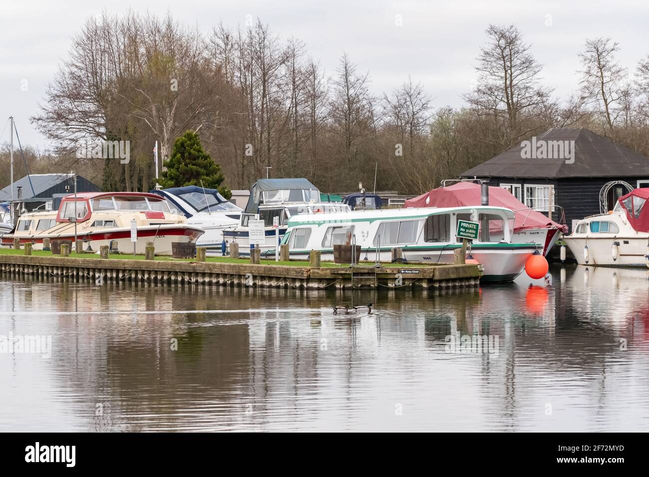 Horning, Norfolk, UK – April 04 2021. Private boatyard full of cruisers ...
