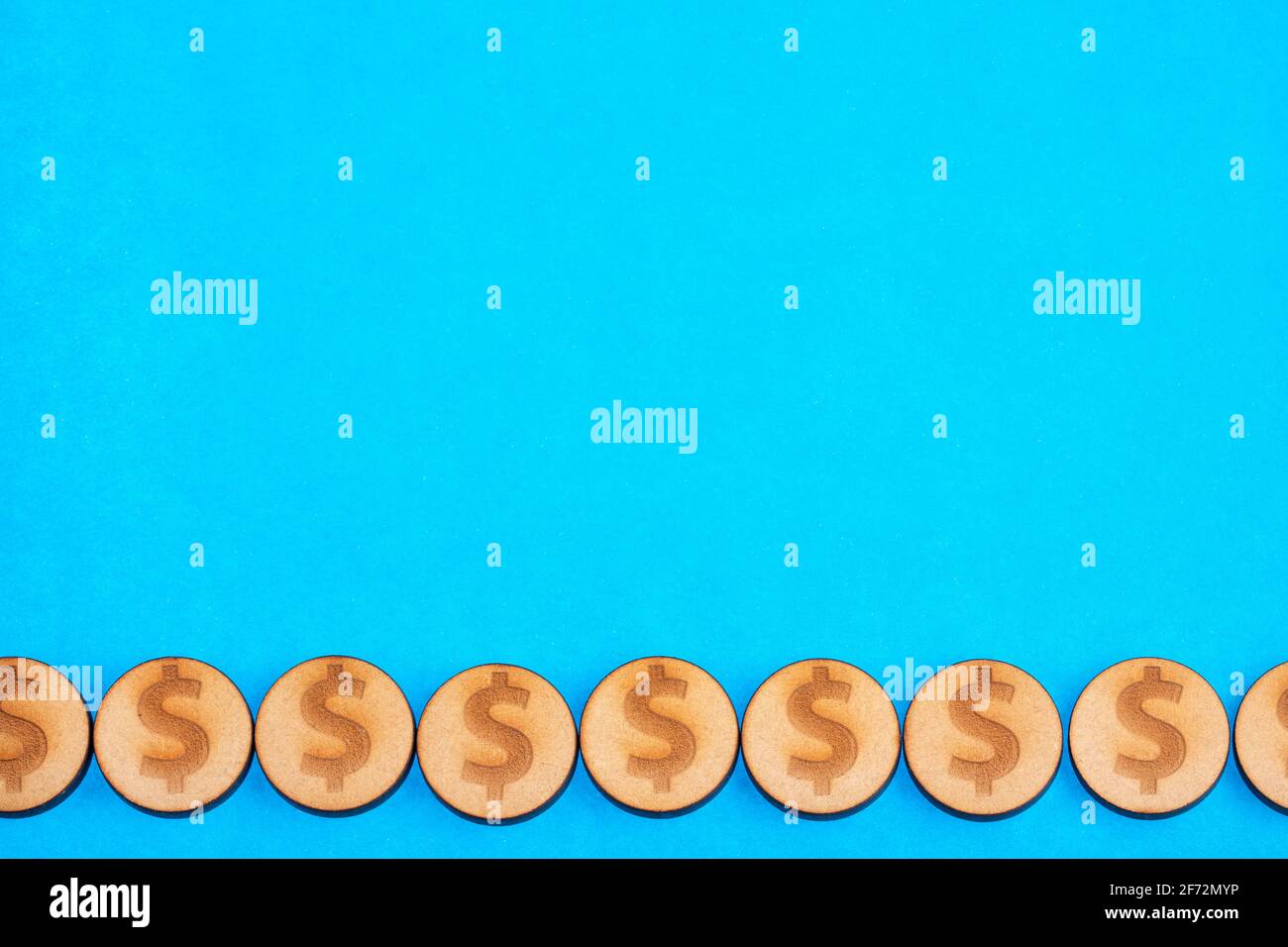 Savings concept with coins - Blue background Stock Photo - Alamy