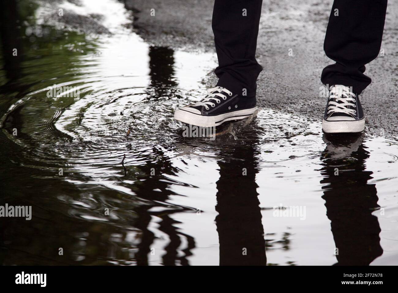 Sneakers in puddle hi-res stock photography and images - Alamy