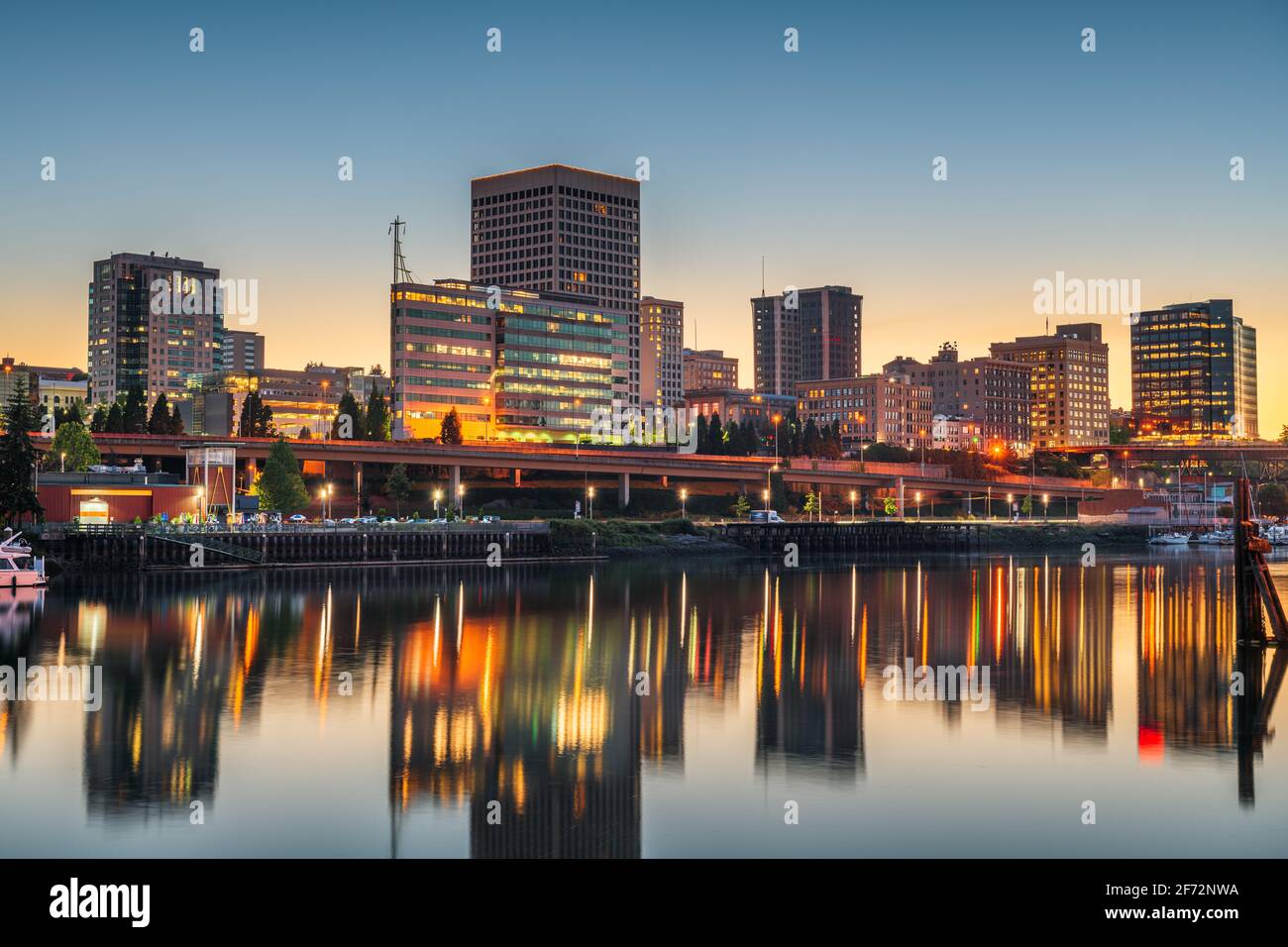 Tacoma, Washington, USA downtown skyline at dusk on Commencement Bay ...
