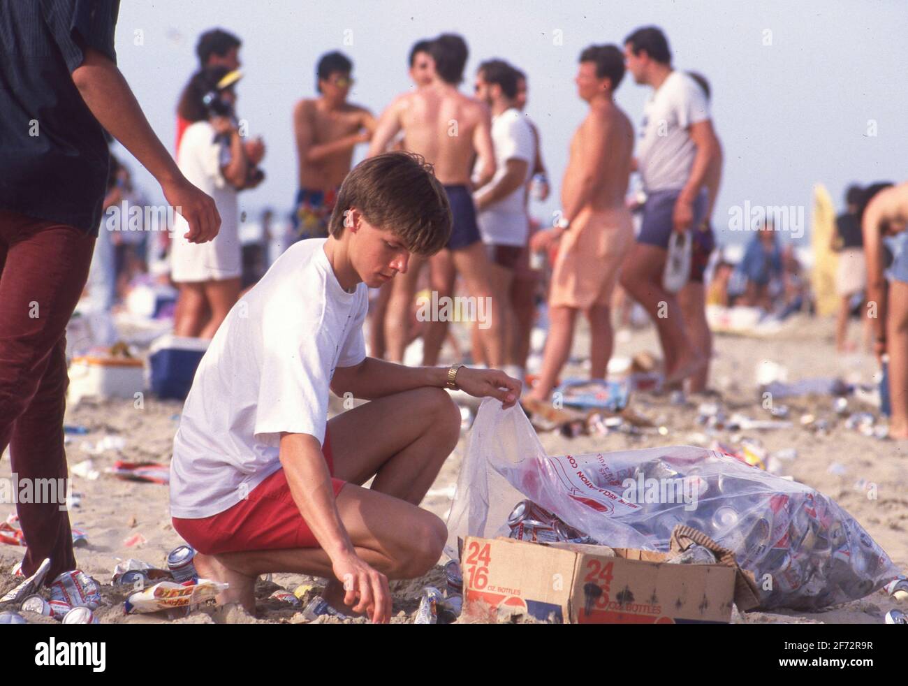 Corpus Christi, TX USA: Young man picks up trash after a concert on a ...
