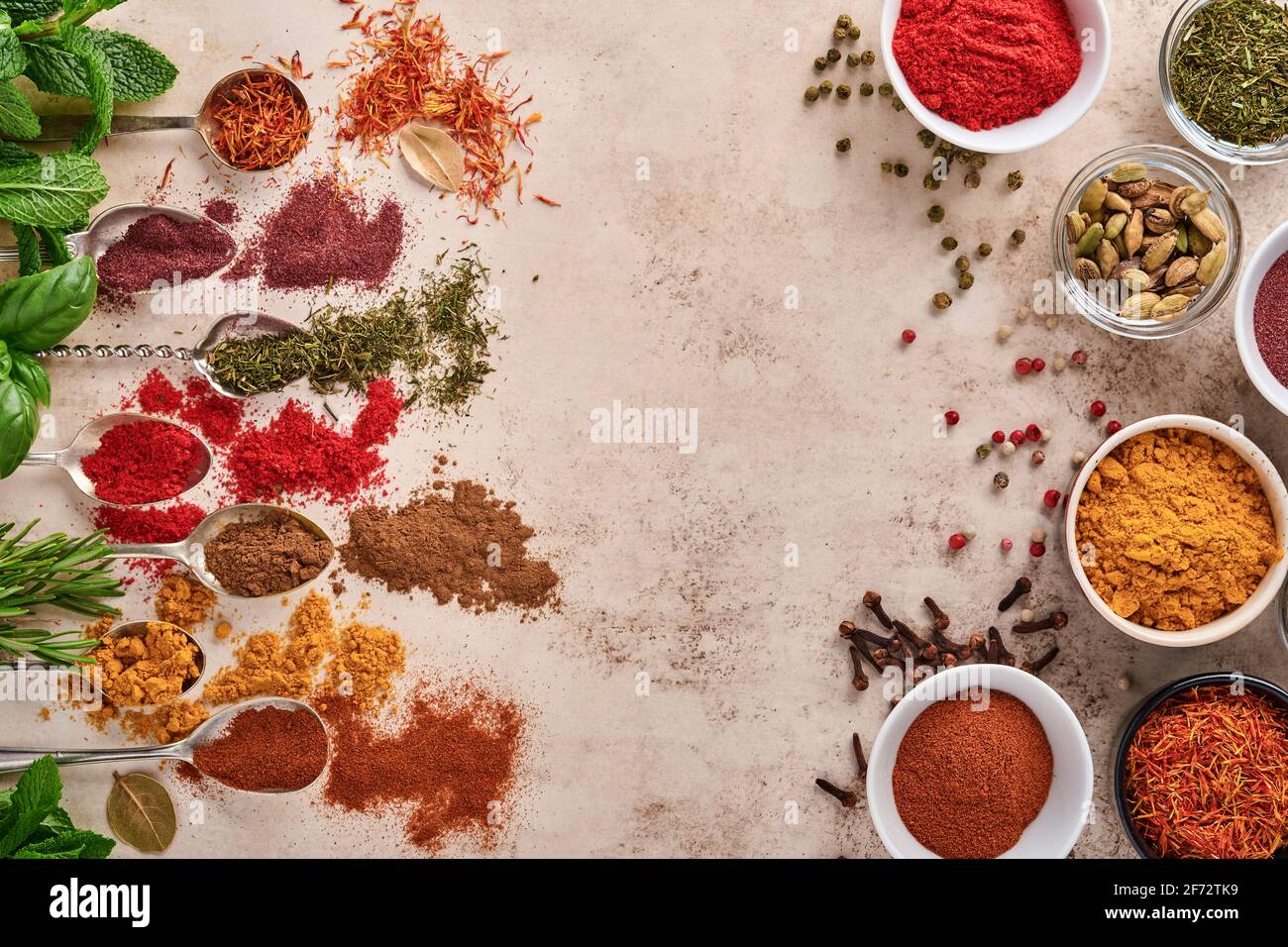 Colorful herbs and spices for cooking: turmeric, dill, paprika ...