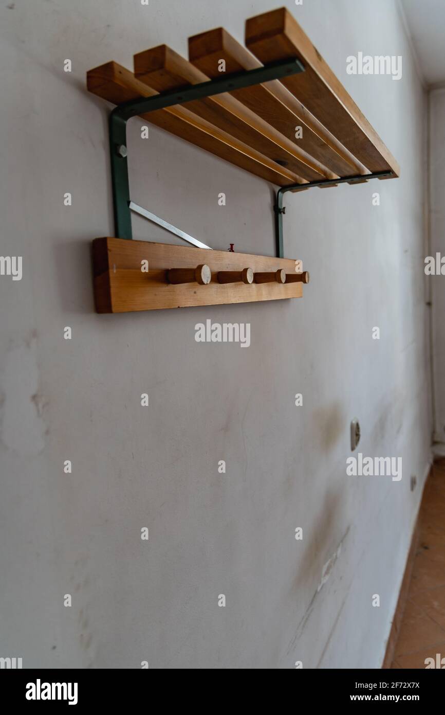 Old Wooden shelf with hangers at Urban exploration of buildings of old ...