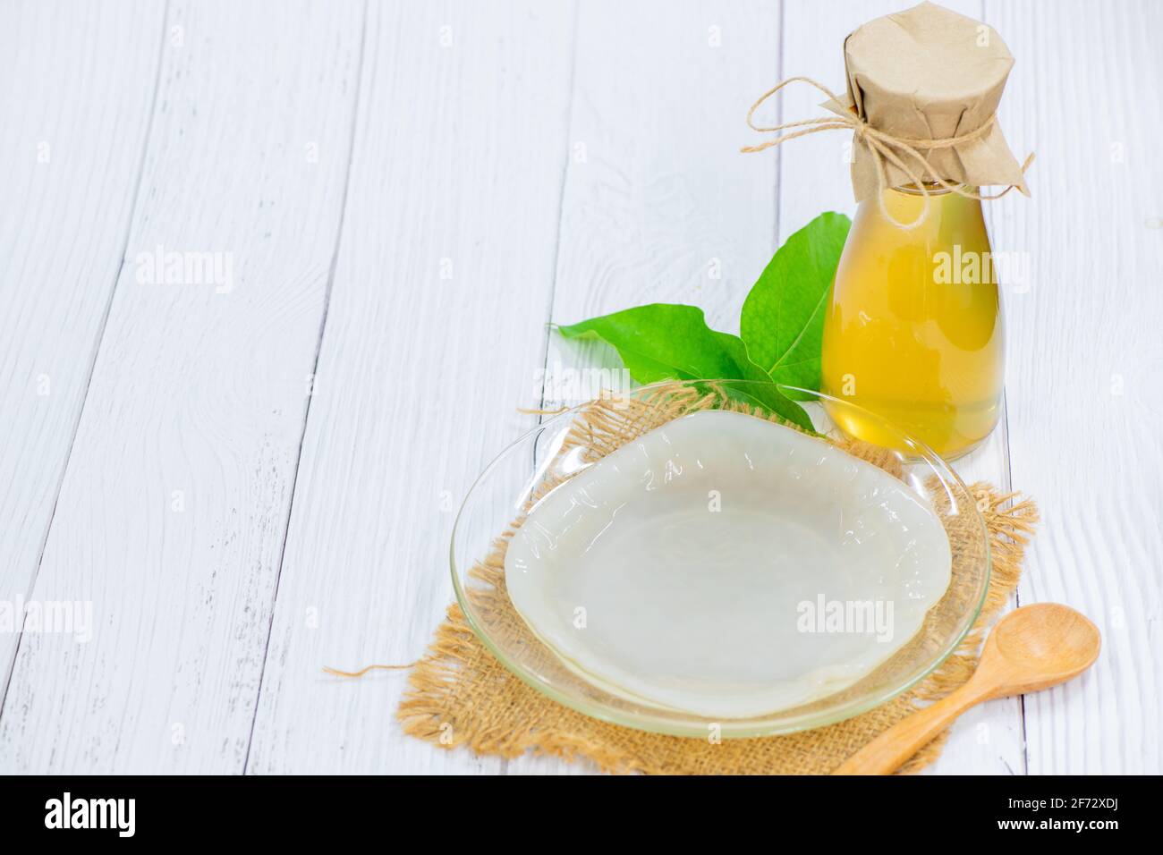 Scoby on dish and Kombucha tea on wood background, cider fermented ...