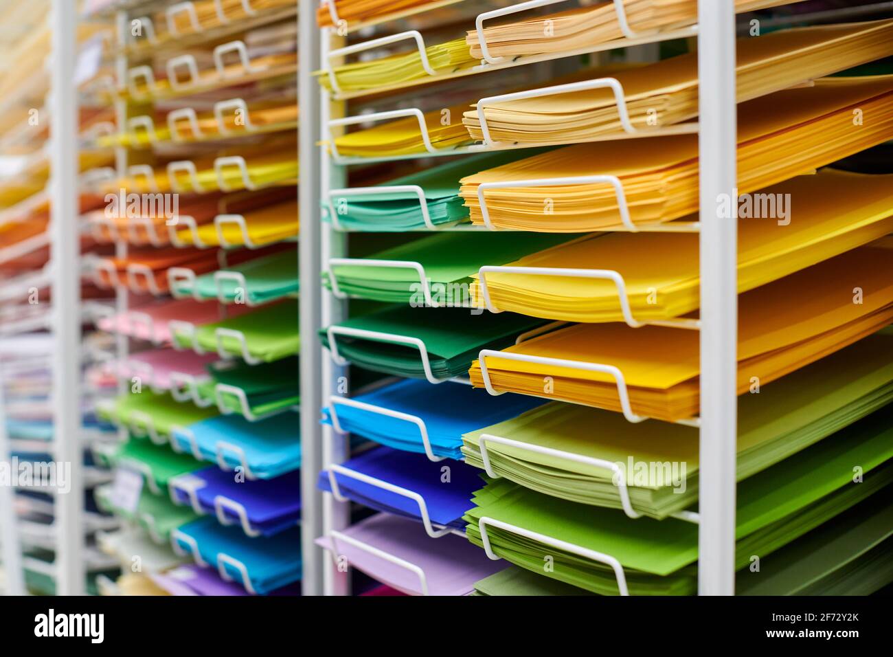 Colorful art papers on shelf display in stationery store, close up ...
