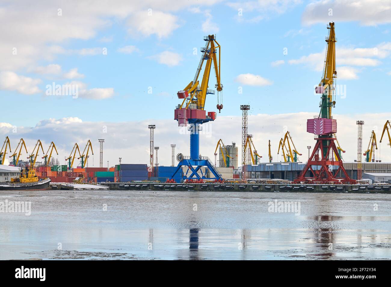 Moored cargo ships and harbor cranes in port. Seaport, cargo container ...