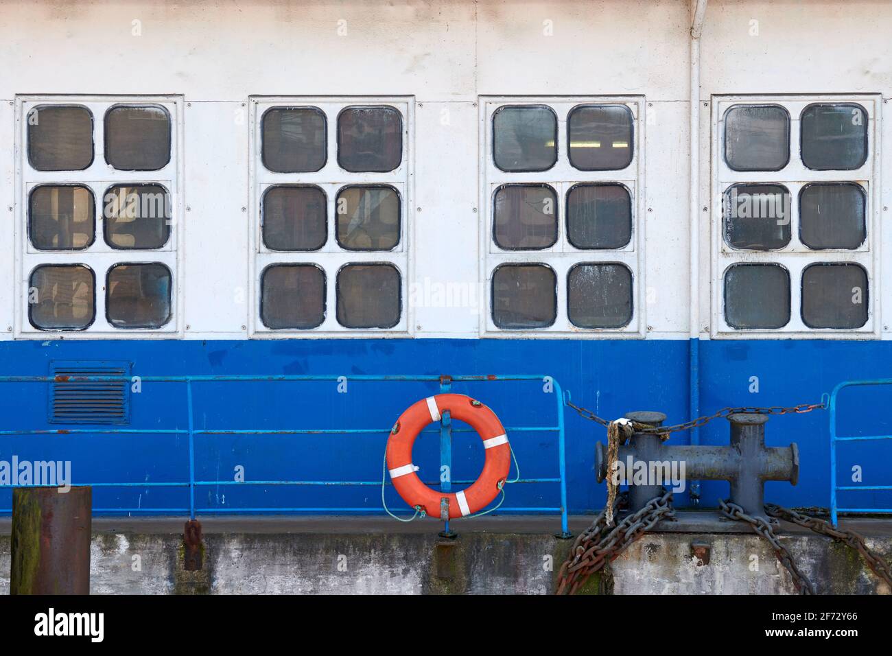 Hull of vintage ocean liner, fragment of moored ship in port. Cabin ...