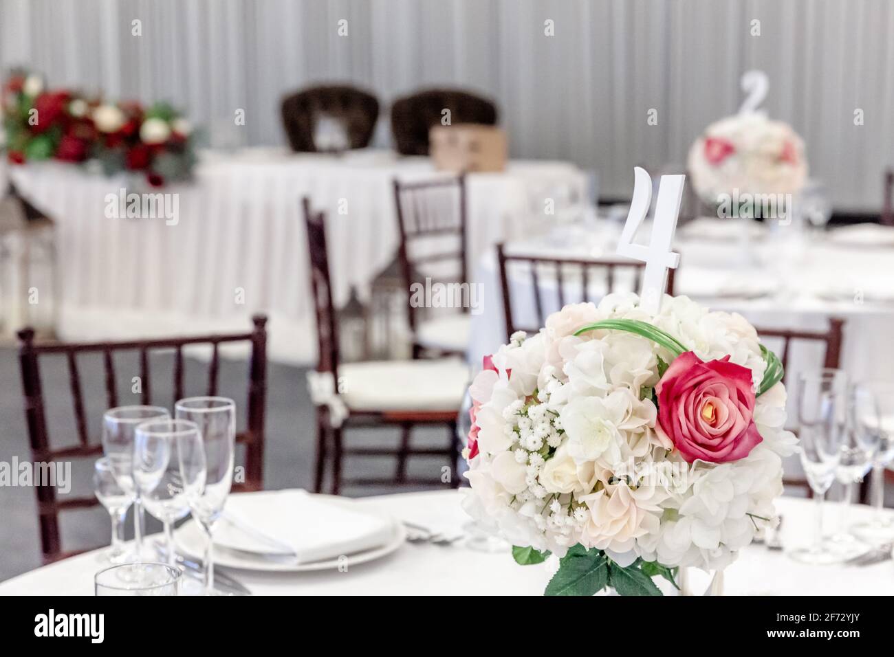 Fancy table set for dinner with flower composition in restaurant ...