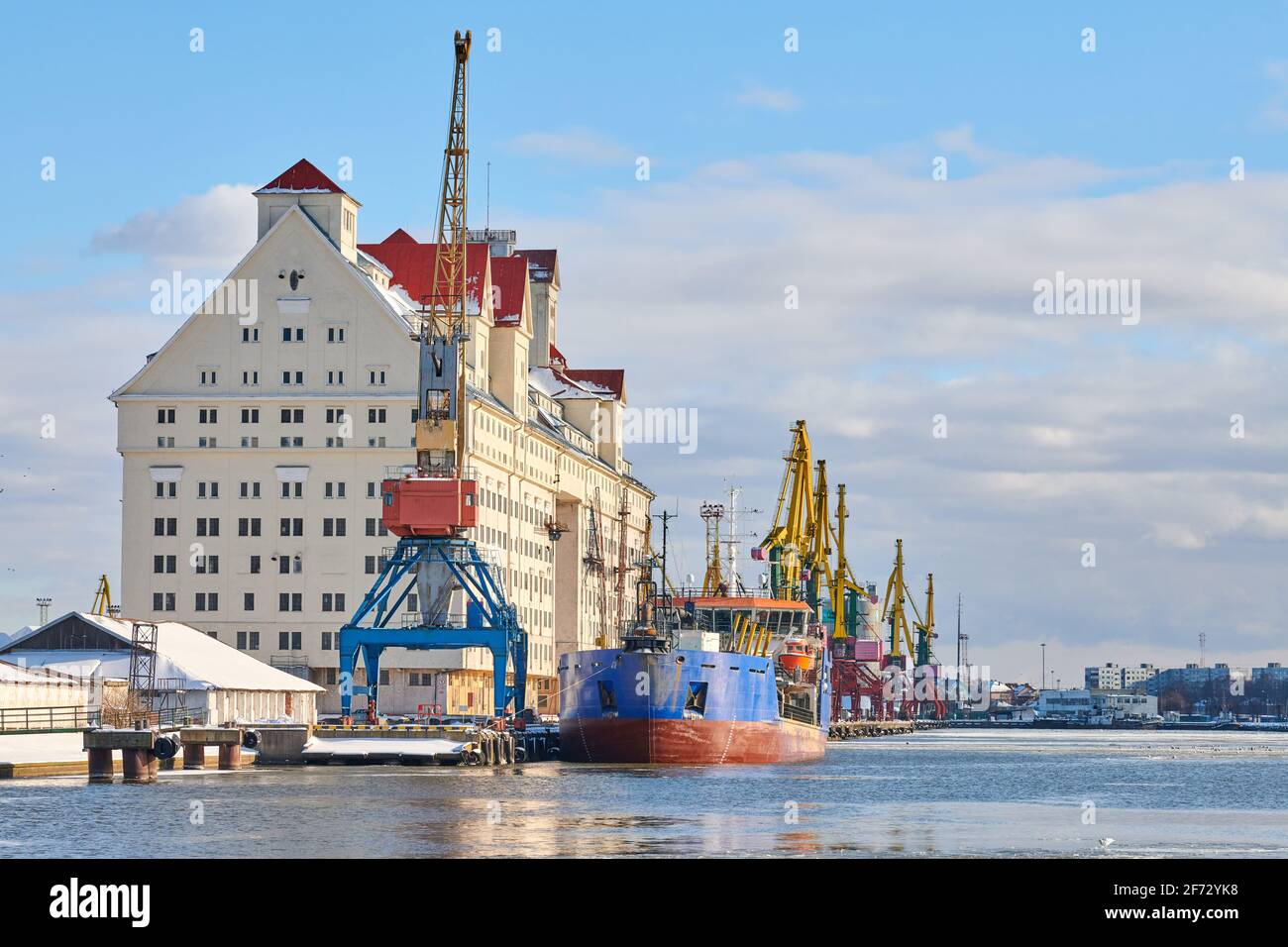 Moored cargo ships and harbor cranes in port. Seaport, cargo container ...