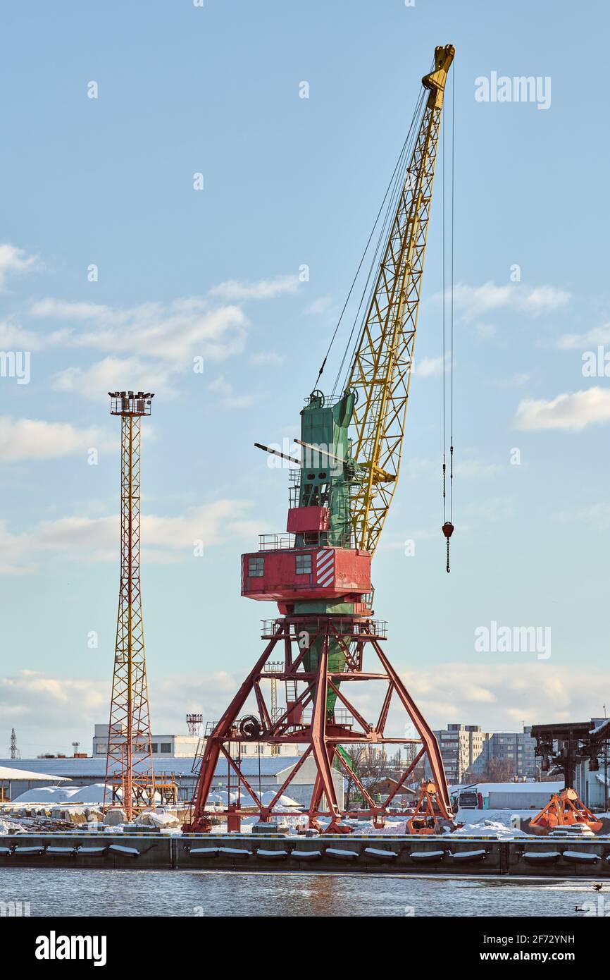 Massive harbor cranes in seaport. Heavy load dockside cranes in port ...