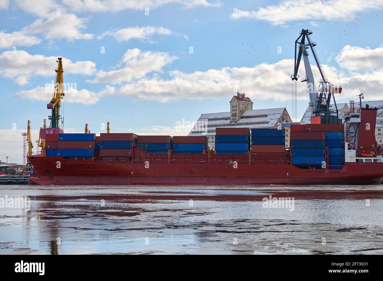 Moored cargo ships and harbor cranes in port. Seaport, cargo container ...