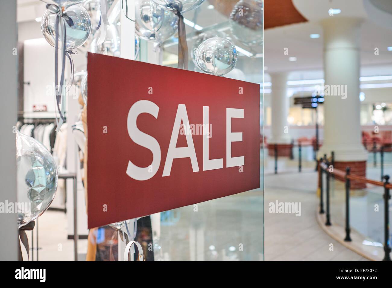Sale time at european shopping center. Christmas promotions in clothing ...