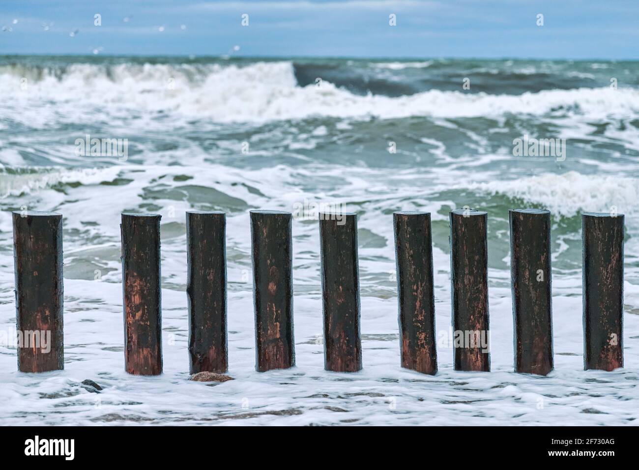 Waves splashing up the groynes hi-res stock photography and images - Alamy