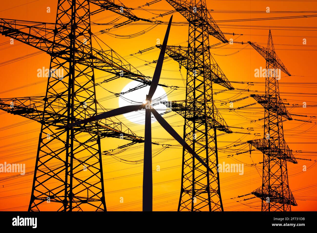 Overhead lines, wind turbine, sunset, Baden-Wuerttemberg, Germany Stock ...
