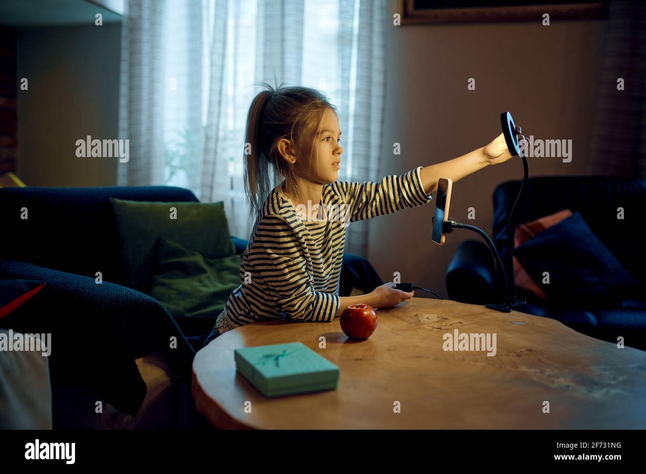 Little girl records vlog on camera, child vlogger Stock Photo - Alamy