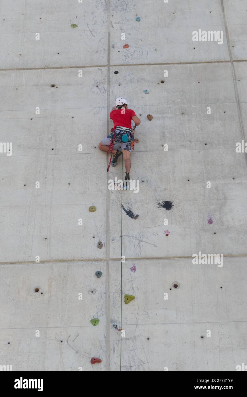 Climber training on vertical wall in a climbing wall. Fitness, extreme ...