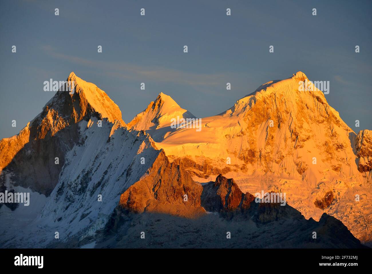 Shining mountain range Nevado Huandoy at sunrise, Cordillera Blanca ...