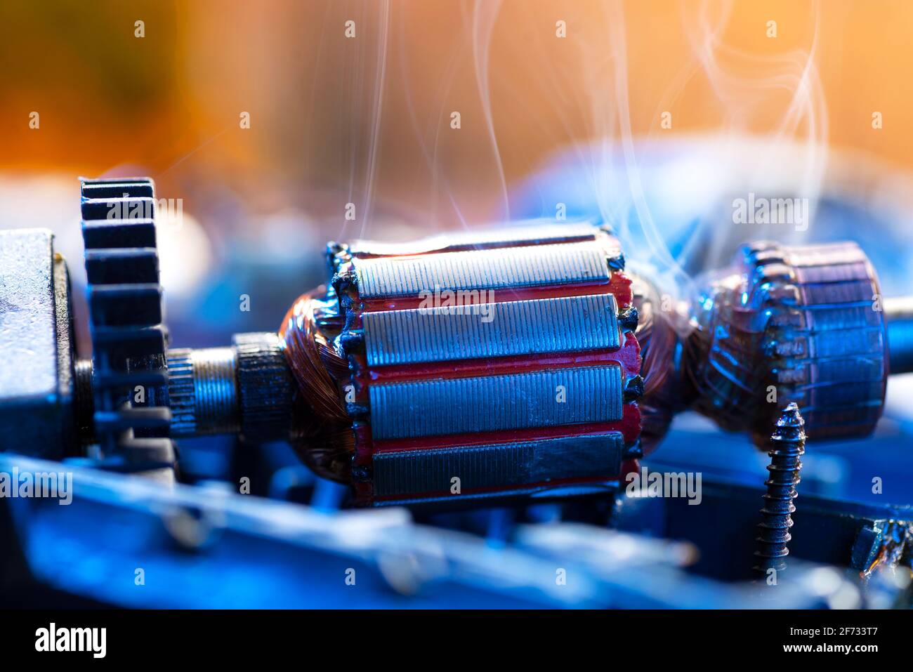 Burning wires on the details of an electrical appliance on a wooden ...