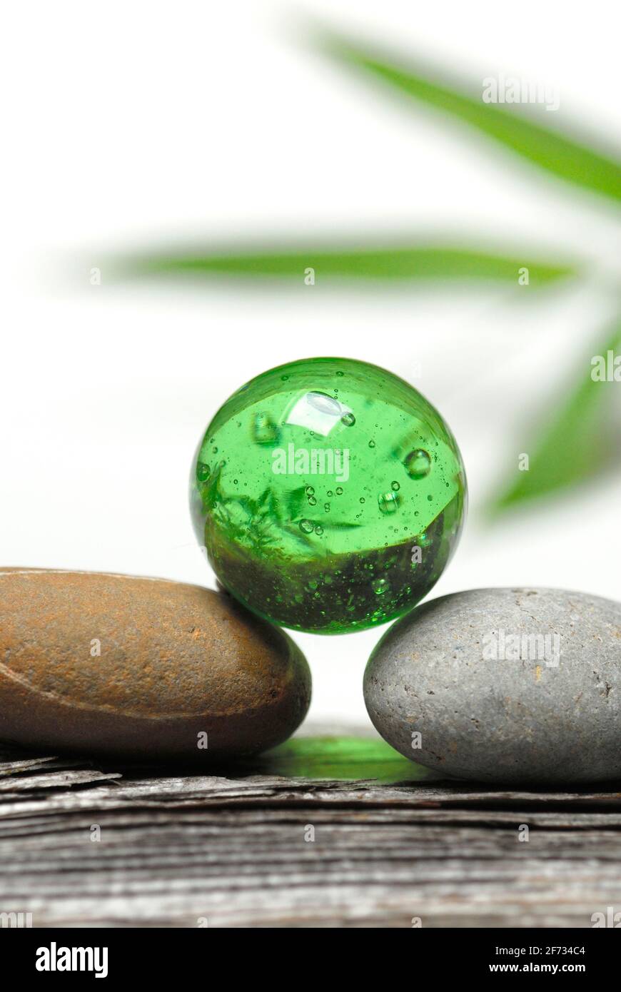 Stacked stones, marble, glass ball Stock Photo - Alamy