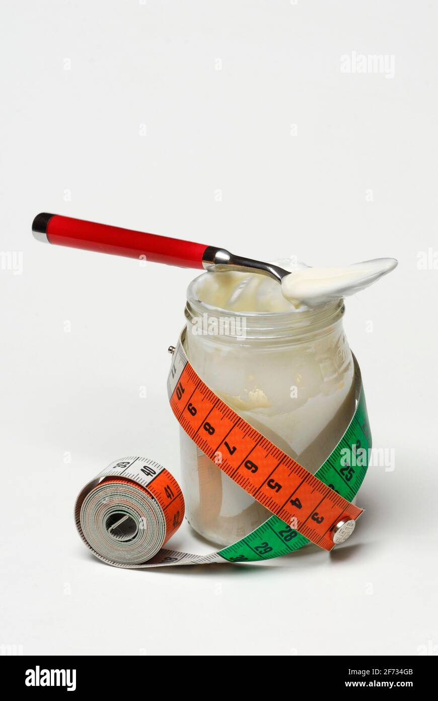 Glass of yoghurt and measuring tape, dairy products Stock Photo - Alamy