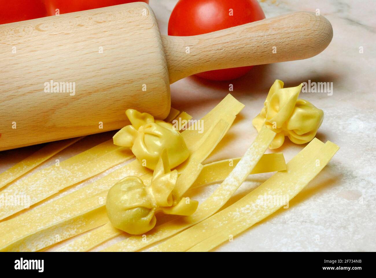Tagliatelle and filled dough beads, ribbon noodles, pearl al basilico ...
