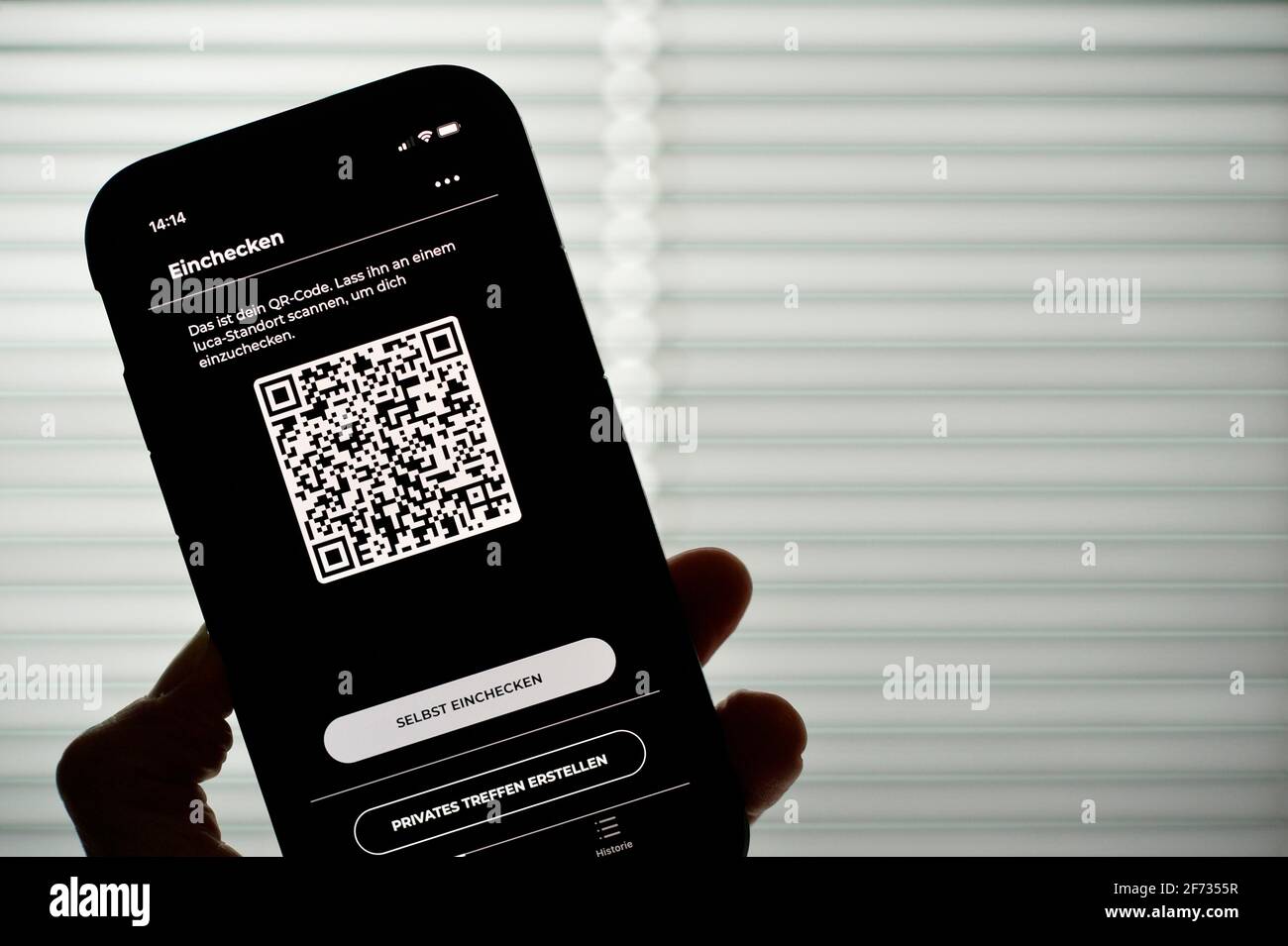 Luca app with QR code in front of window, shutter, Corona crisis ...