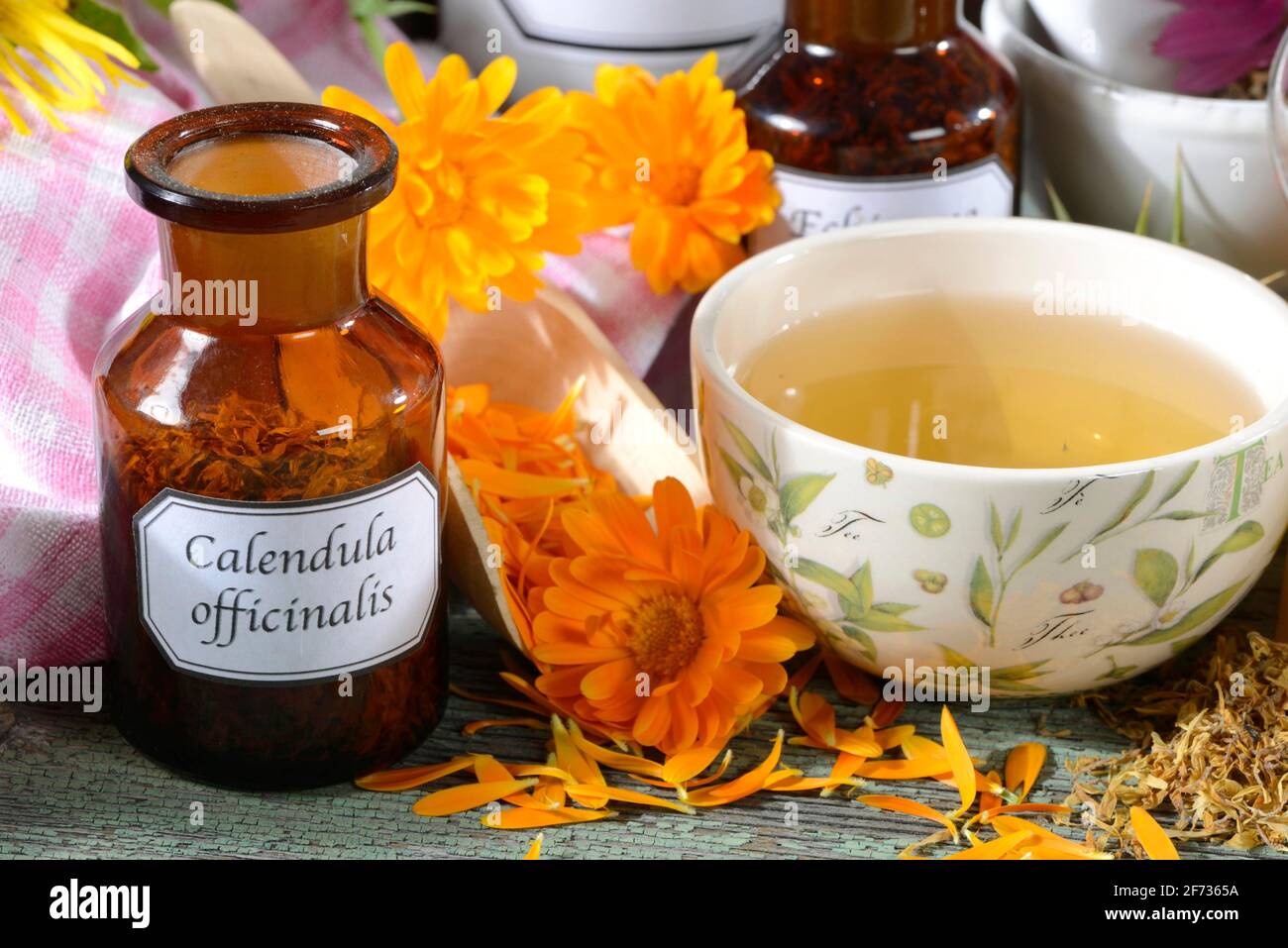 Marigold (Calendula officinalis), dried flowers, cup of marigold tea ...