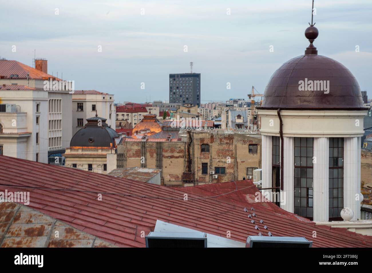 Eclectic downtown rooftops seen from the roof with the romanesque dome ...