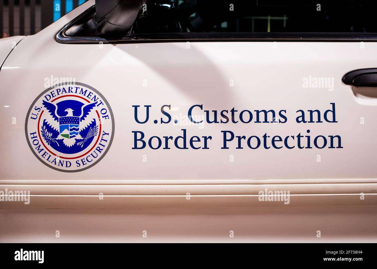 Customs and Border patrol logo on the side of the white patrol car ...