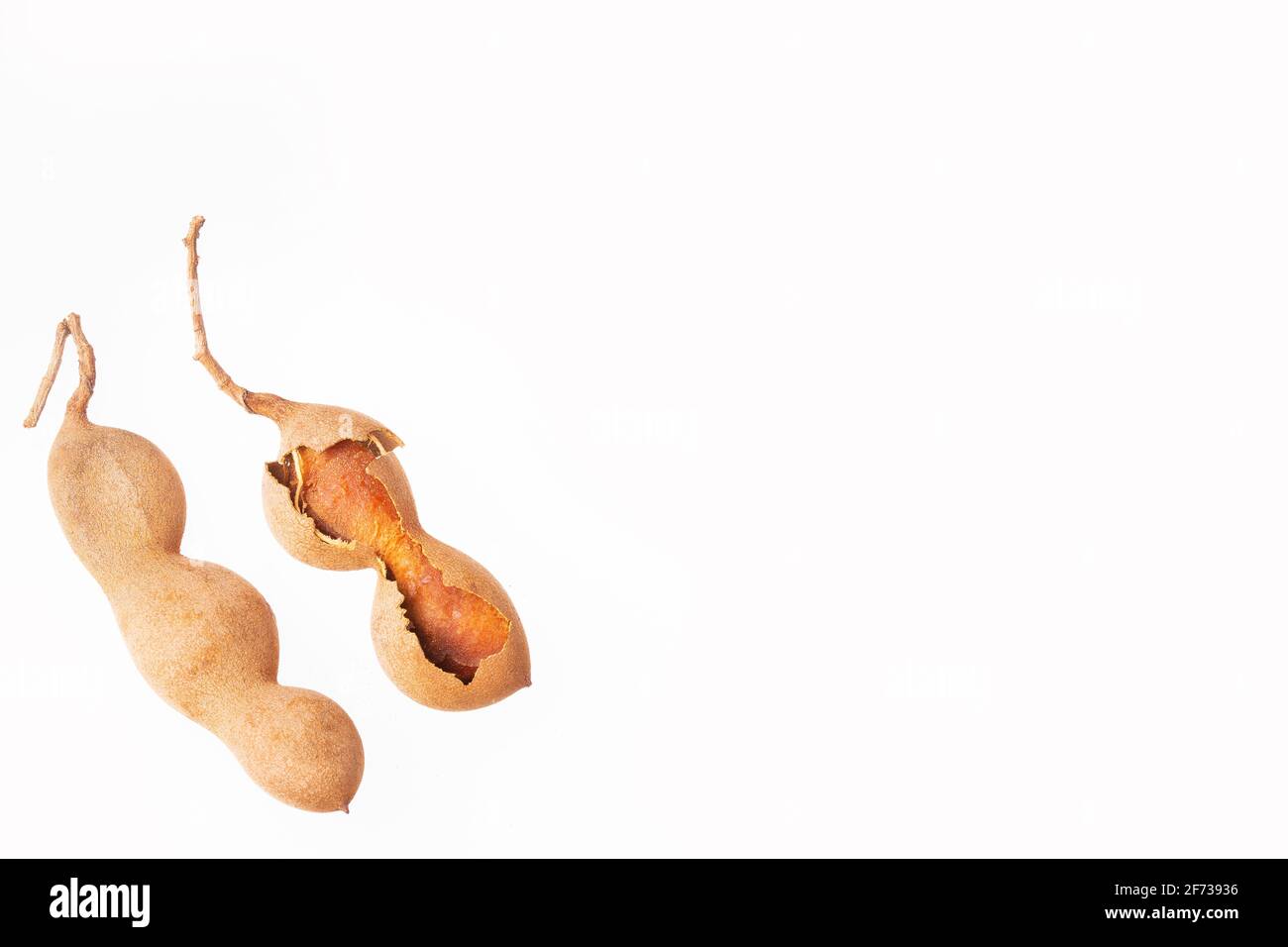 Tamarind tropical fruit - Tamarindus indica. Text space Stock Photo - Alamy