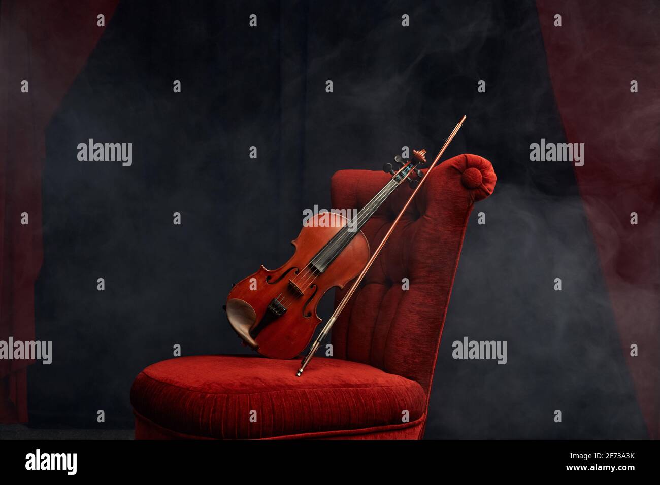 Vintage violin on chair hi-res stock photography and images - Alamy