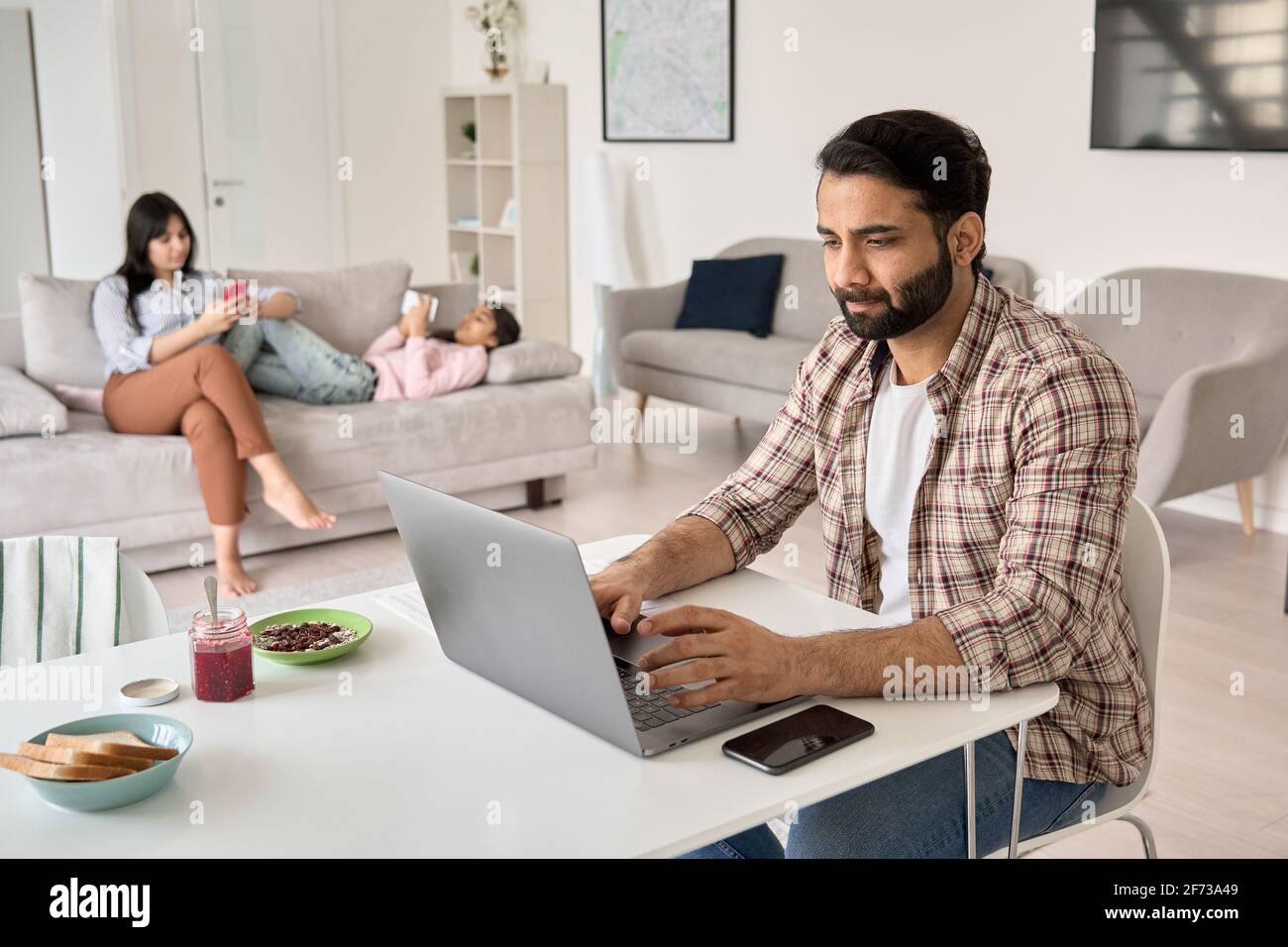 Indian business man father remote working online from home office with ...