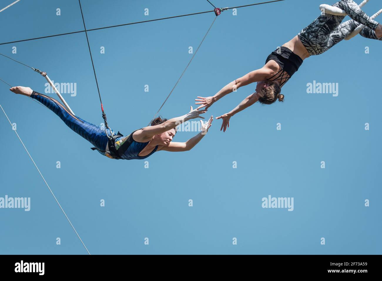 Oxford, UK. 4th Apr, 2021. People take part in flying trapeze lessons ...