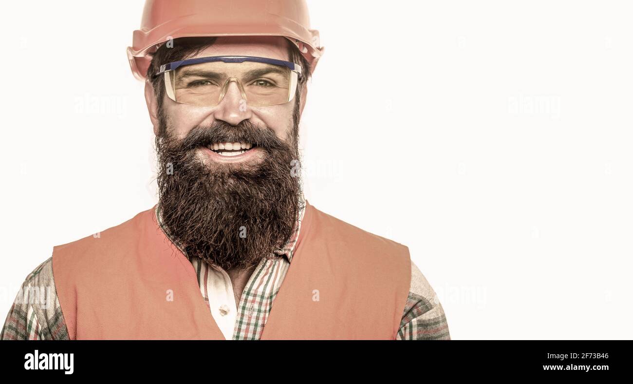 Portrait of a builder smiling. Bearded man worker with beard in ...