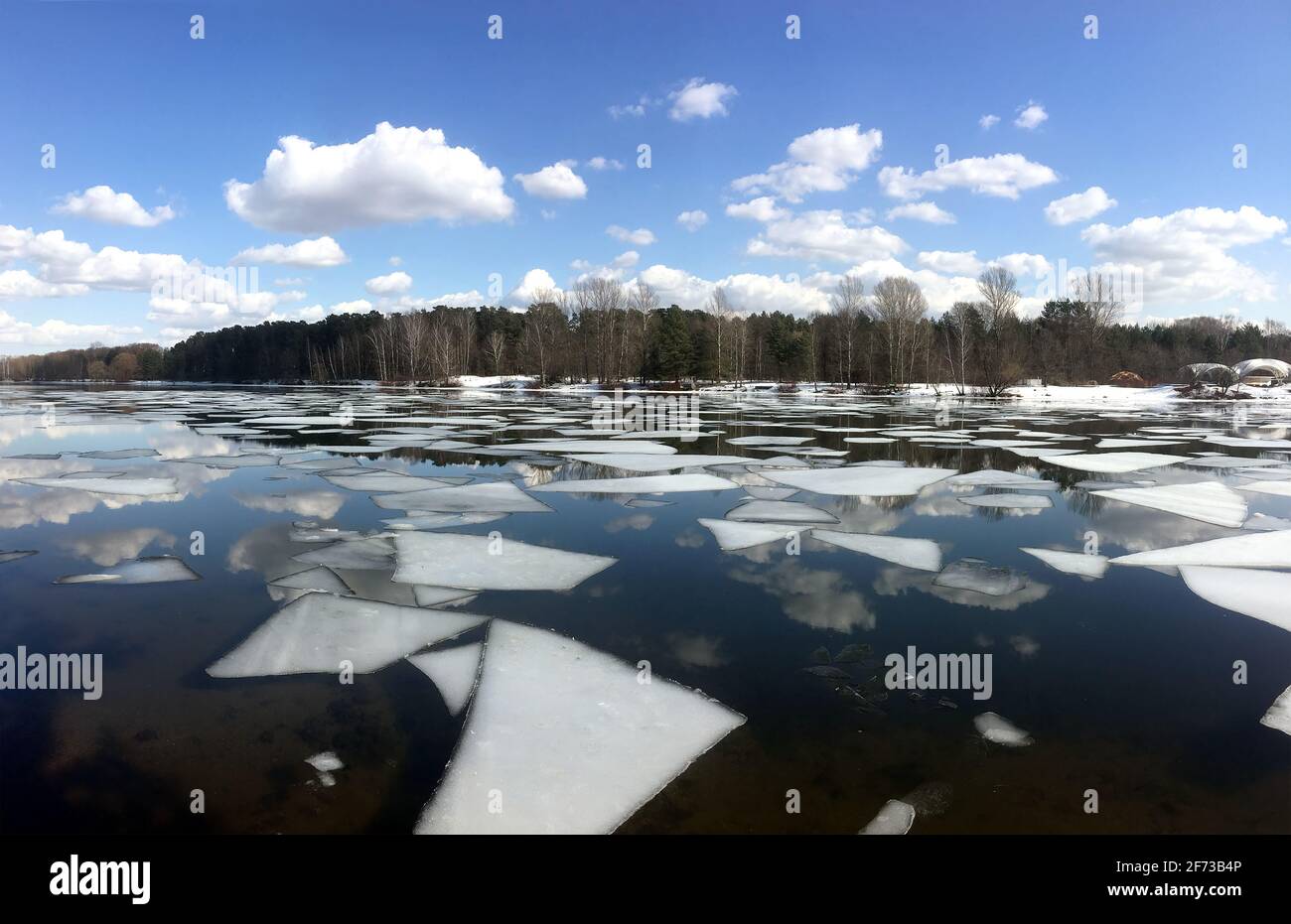 Beautiful natural landscape with ice floes adrift on the spring river ...