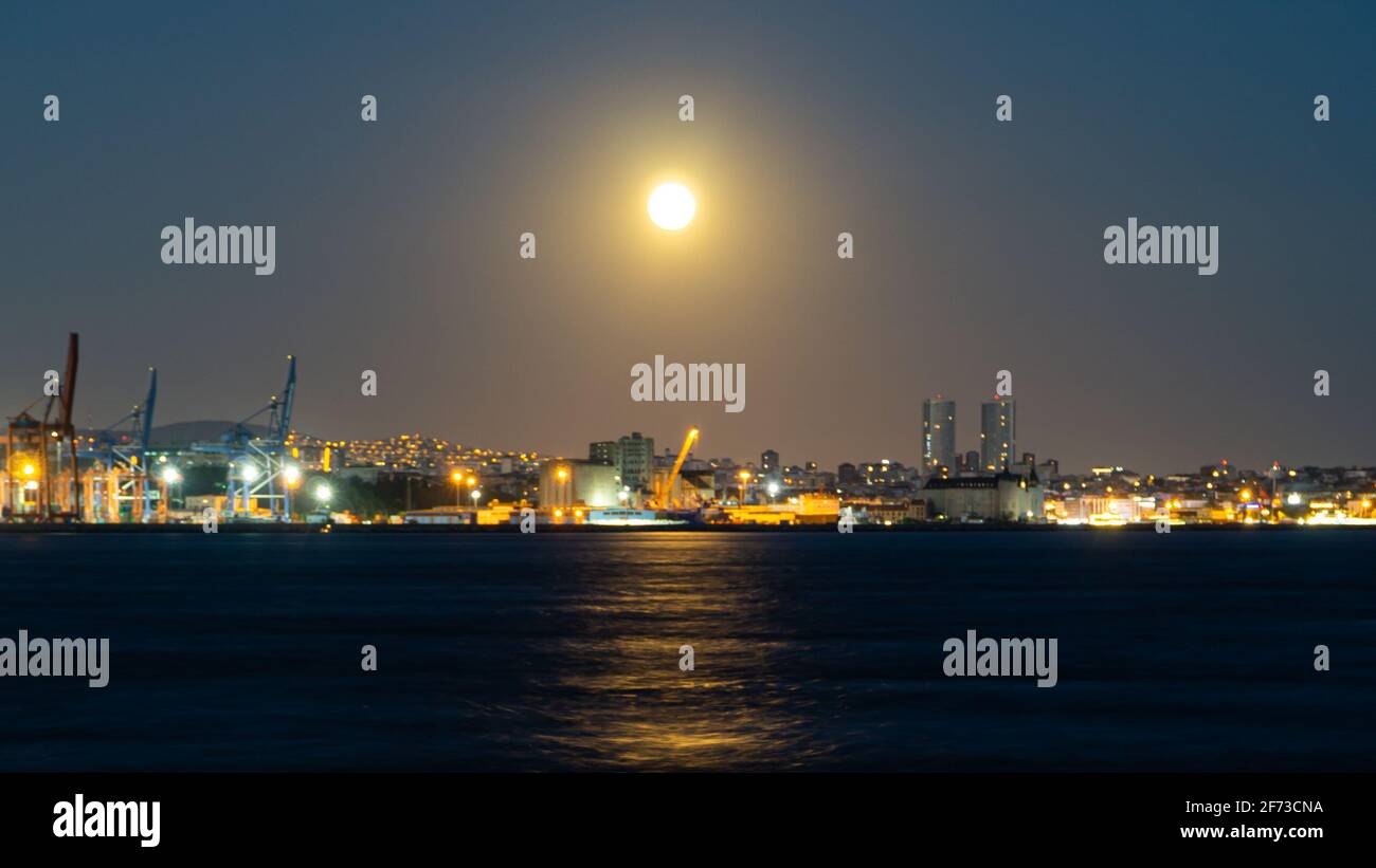 full moon rising over Istanbul skyline Stock Photo - Alamy