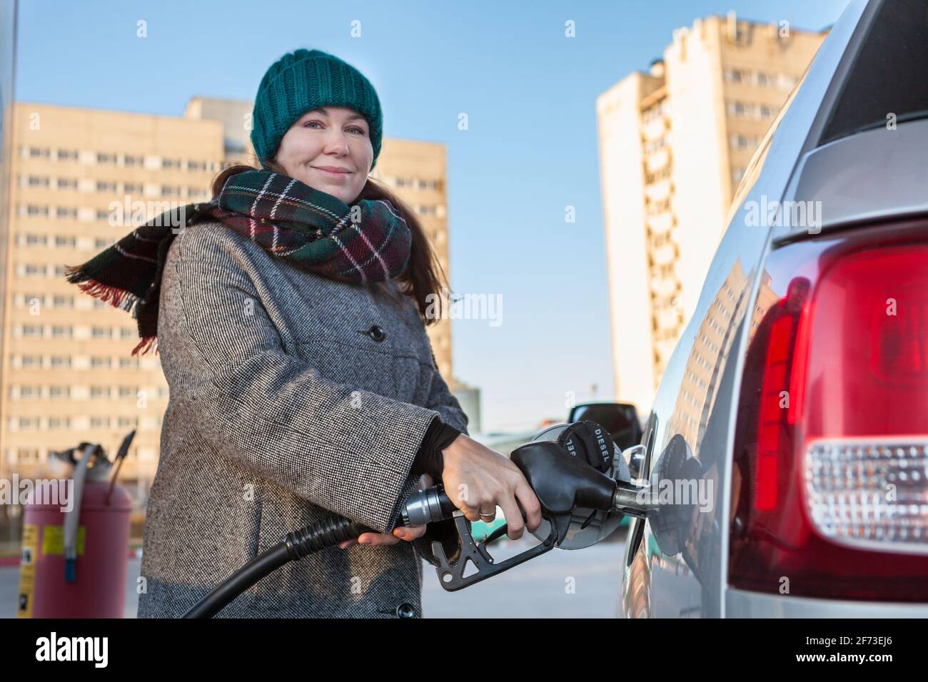 Pretty woman at petrol station hi-res stock photography and images - Alamy