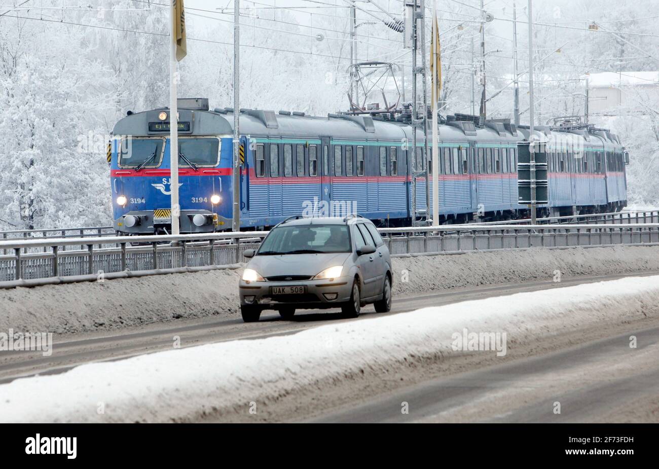 Train and car Stock Photo - Alamy