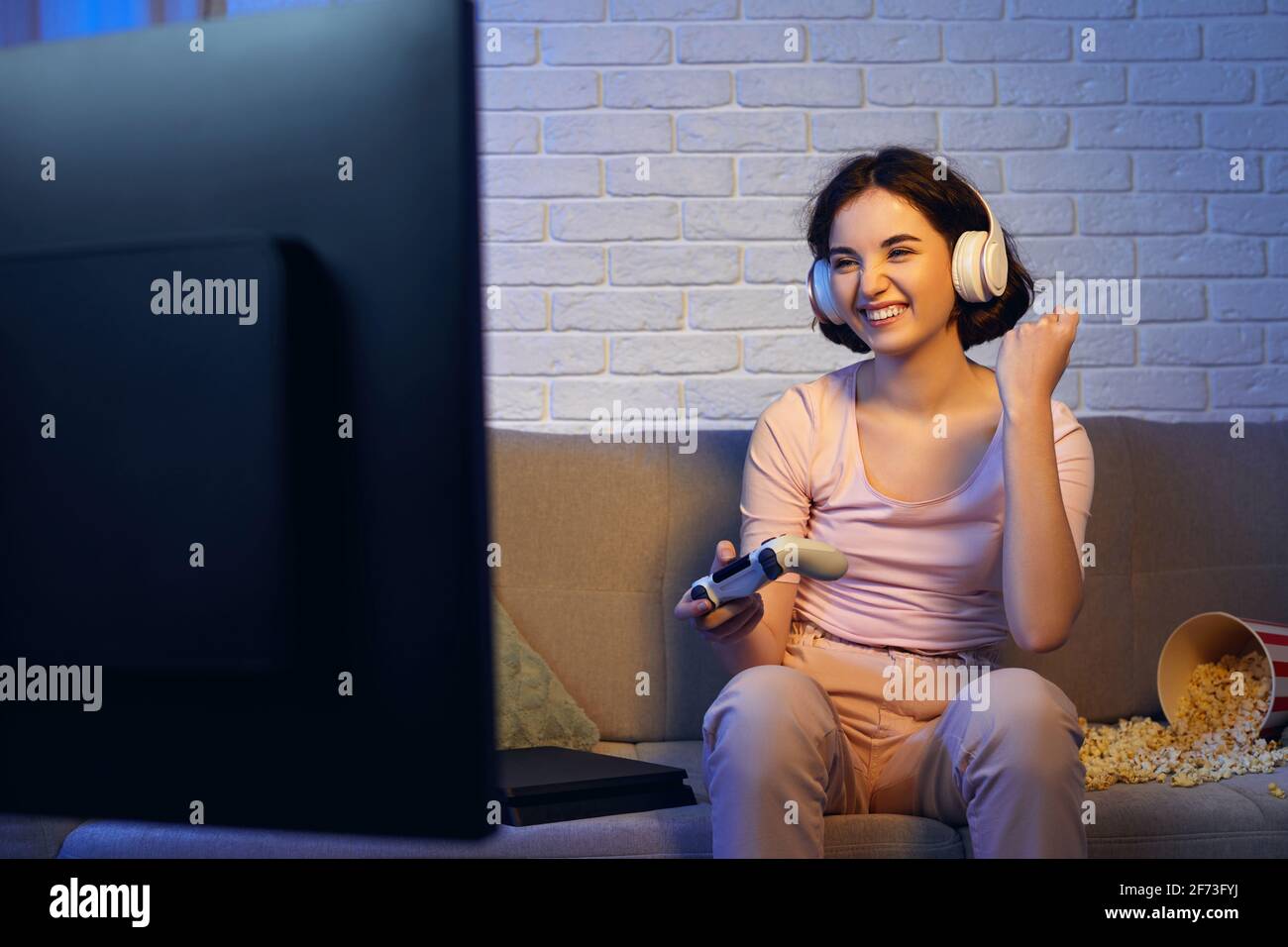 involved gamer girl playing video games on the console Stock Photo - Alamy