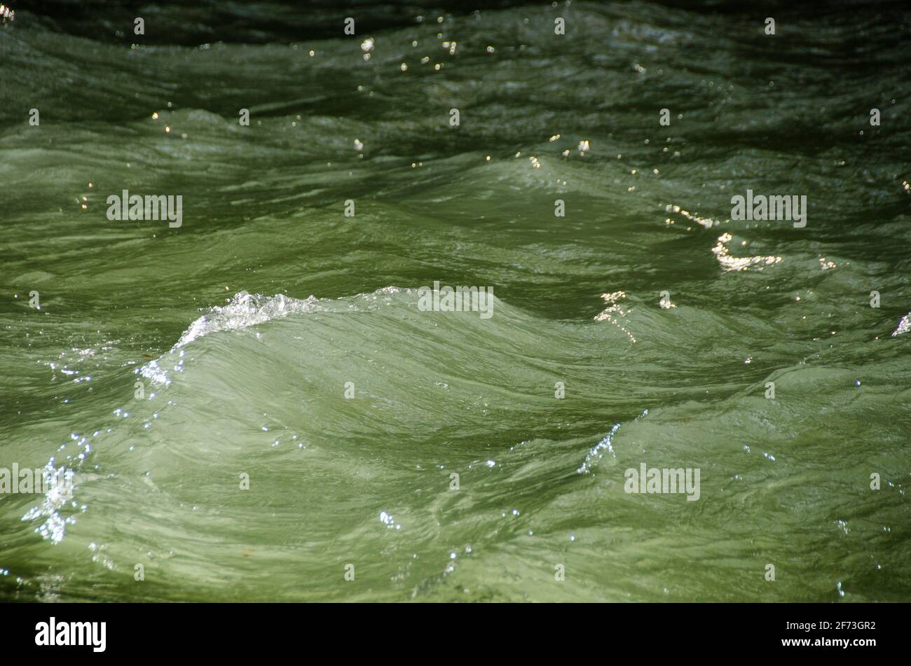 Abstract background of river water flow under the influence of light ...