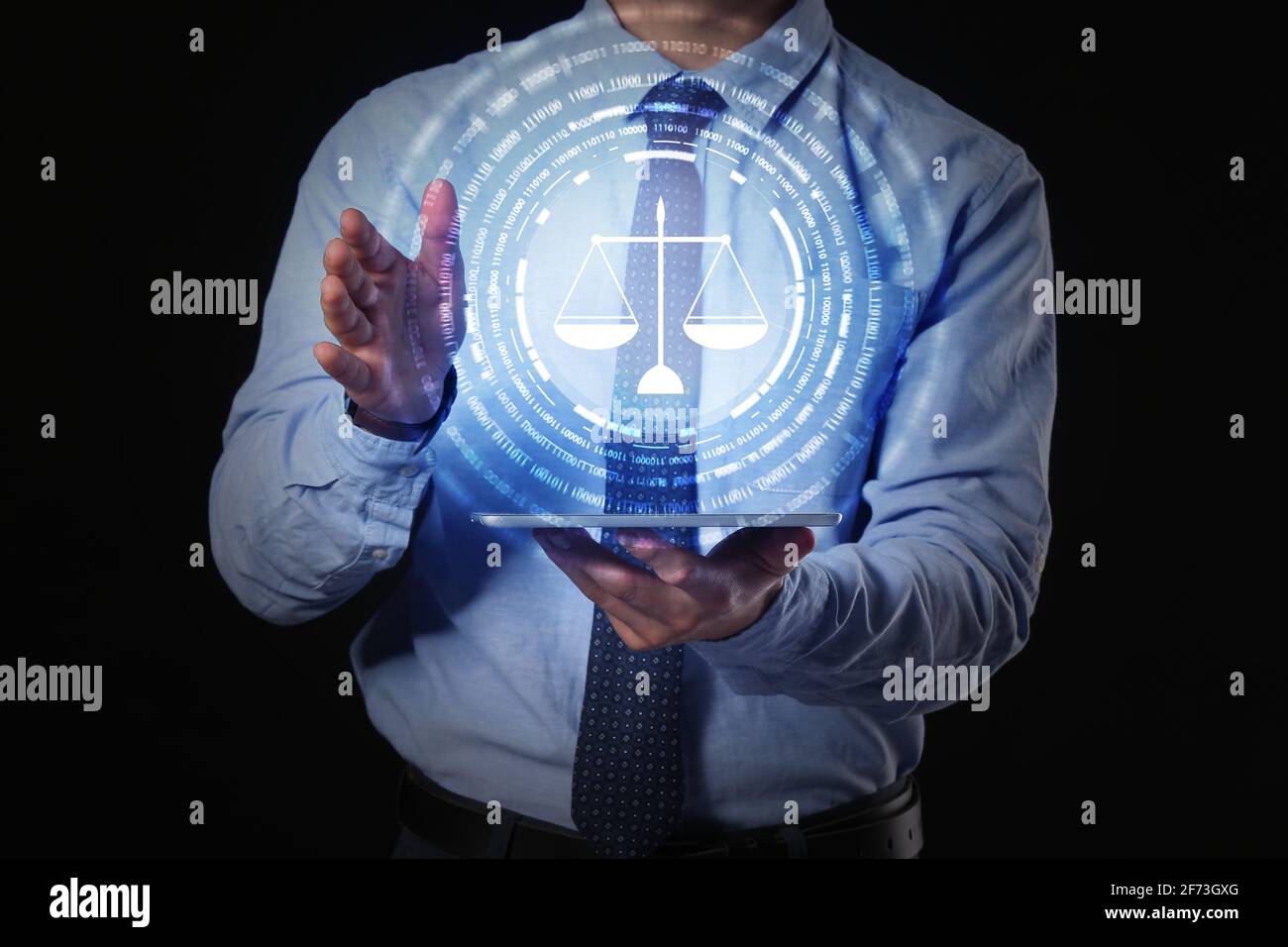 Male lawyer with tablet computer using virtual screen on dark ...