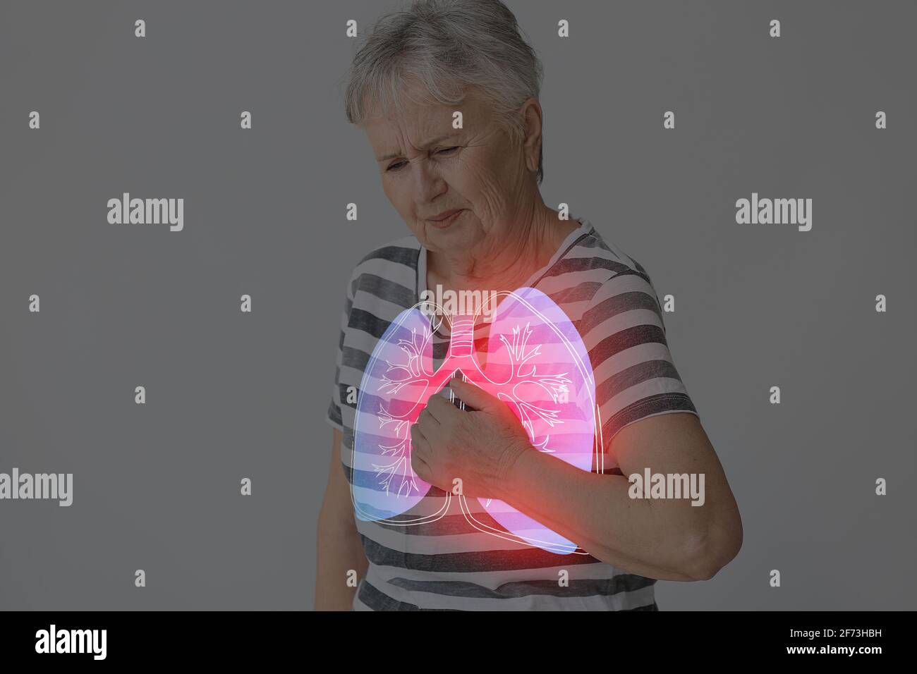 Sick senior woman with lung problems on grey background Stock Photo - Alamy