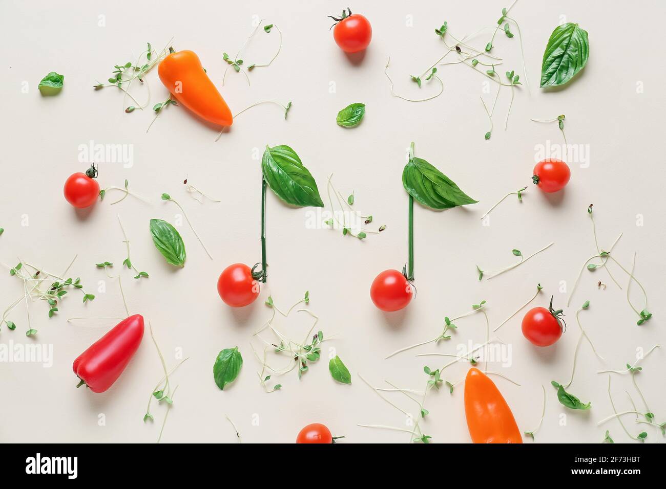Music notes made of fresh vegetables and herbs on white background ...