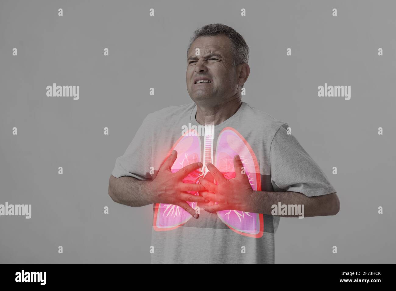 Sick mature man with lung problems on grey background Stock Photo - Alamy