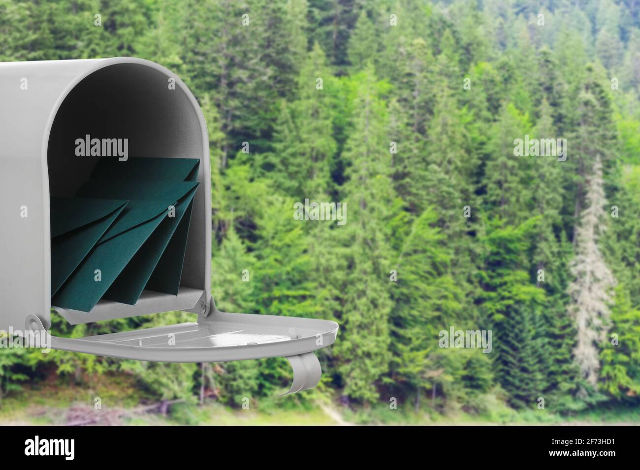 Mail box with letters in forest Stock Photo - Alamy