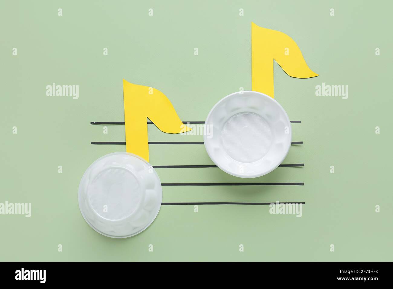 Music notes made of plastic plates on color background Stock Photo - Alamy